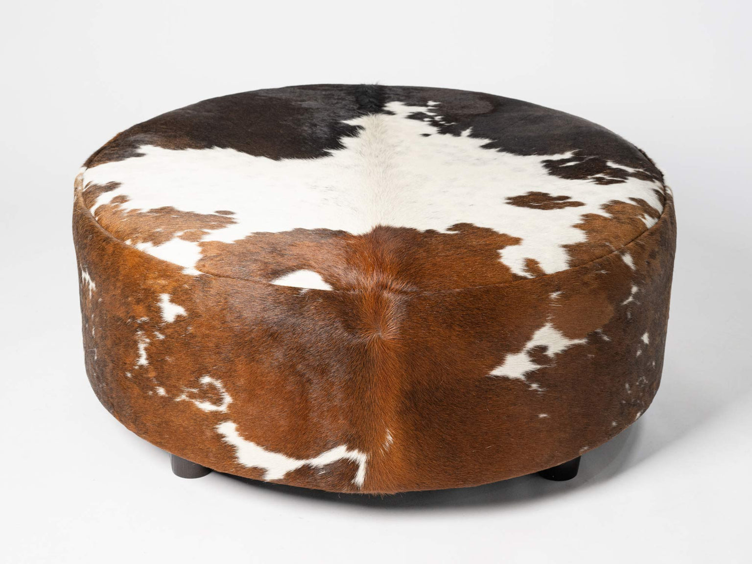 Round Cowhide Ottoman Coffee Tables — Gorgeous Creatures