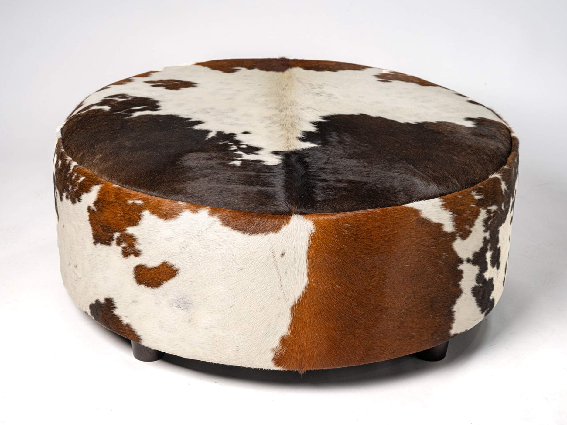 Round Brown Cowhide Ottoman Coffee Table — Gorgeous Creatures