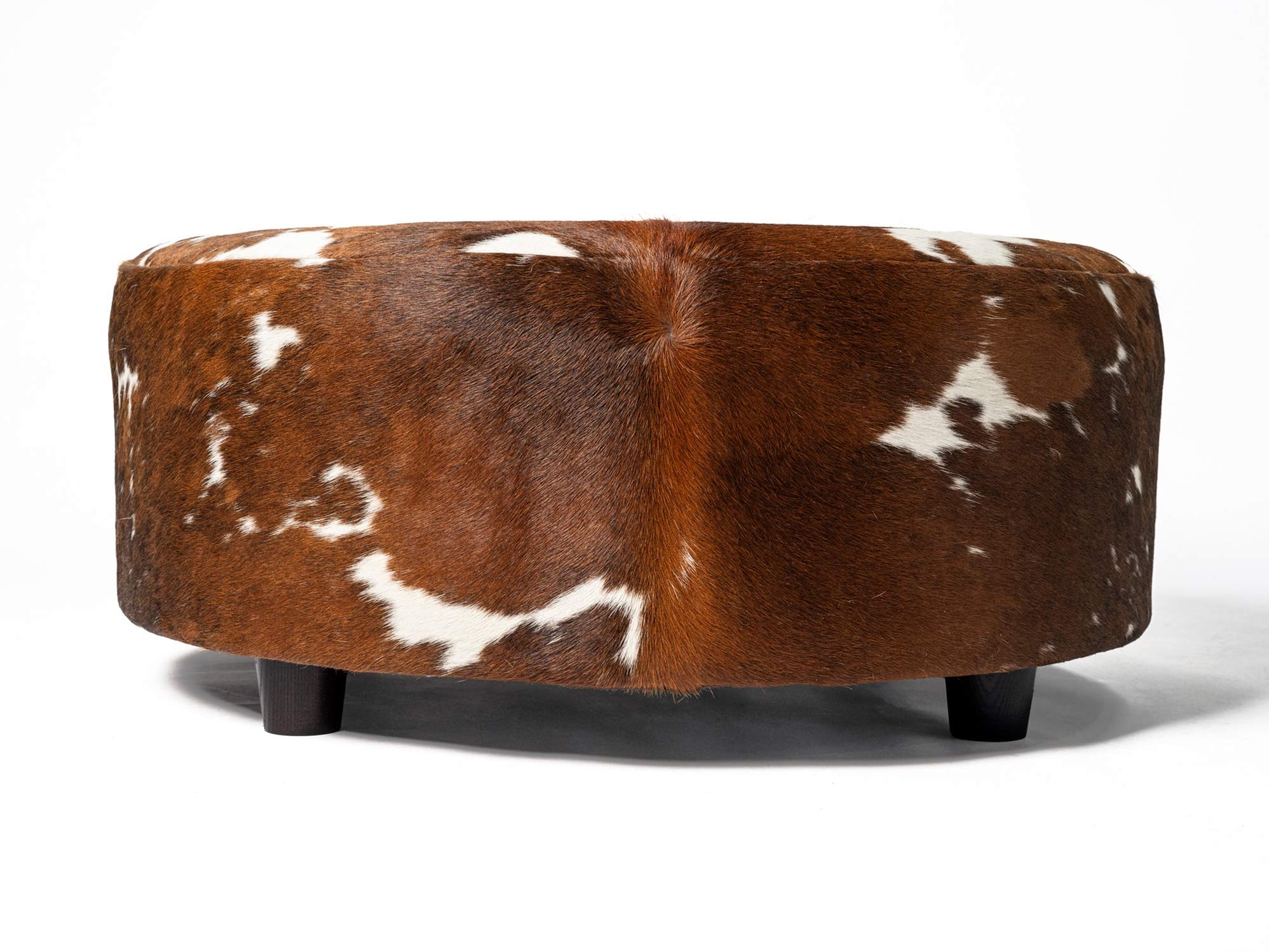 Round Brown Cowhide Ottoman Coffee Table — Gorgeous Creatures